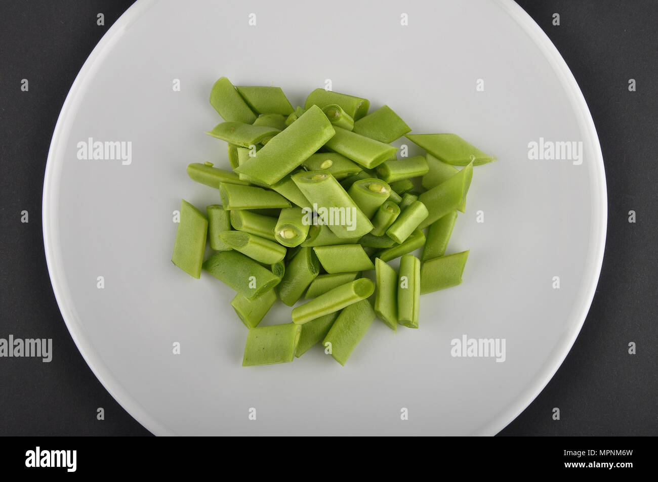 Common beans cut on plate Stock Photo - Alamy