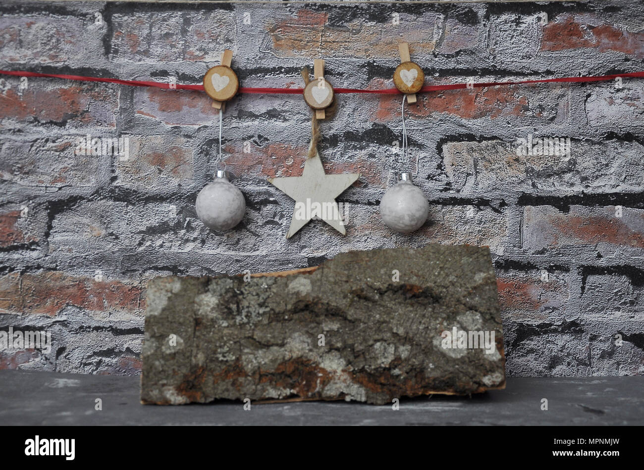 Christmas decoration in front of brick wall Stock Photo - Alamy