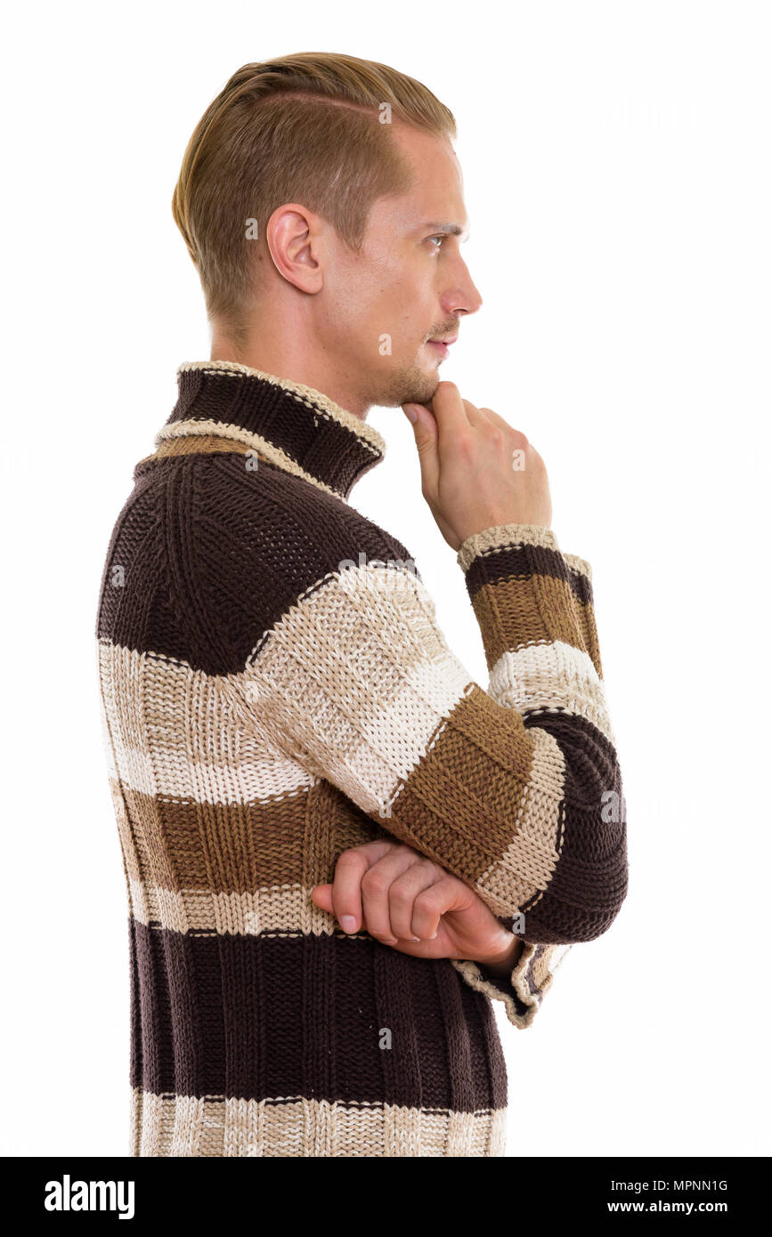 Profile view of young handsome man thinking Stock Photo - Alamy