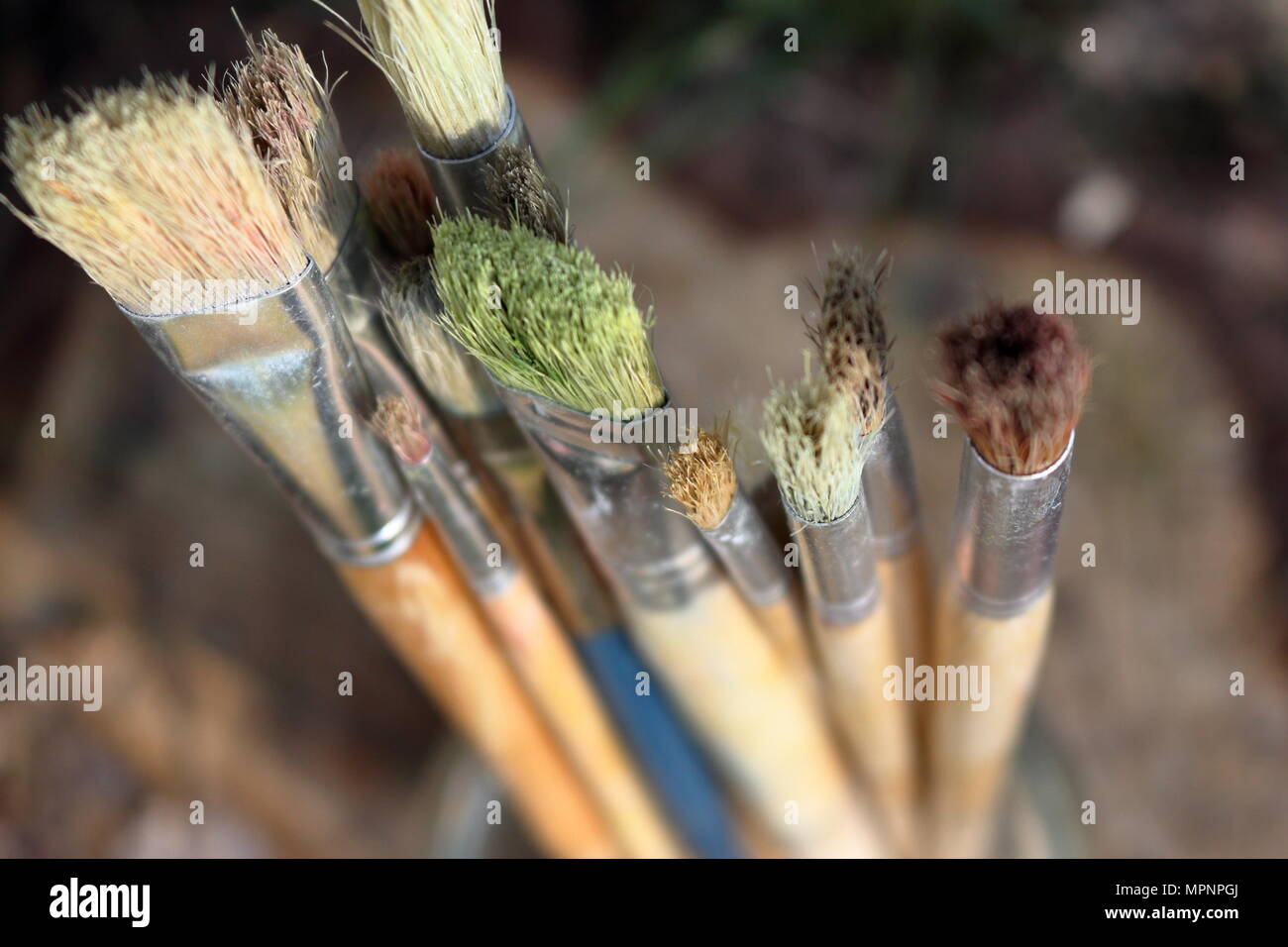 Badly cleaned, overused oil paintbrushes Stock Photo - Alamy
