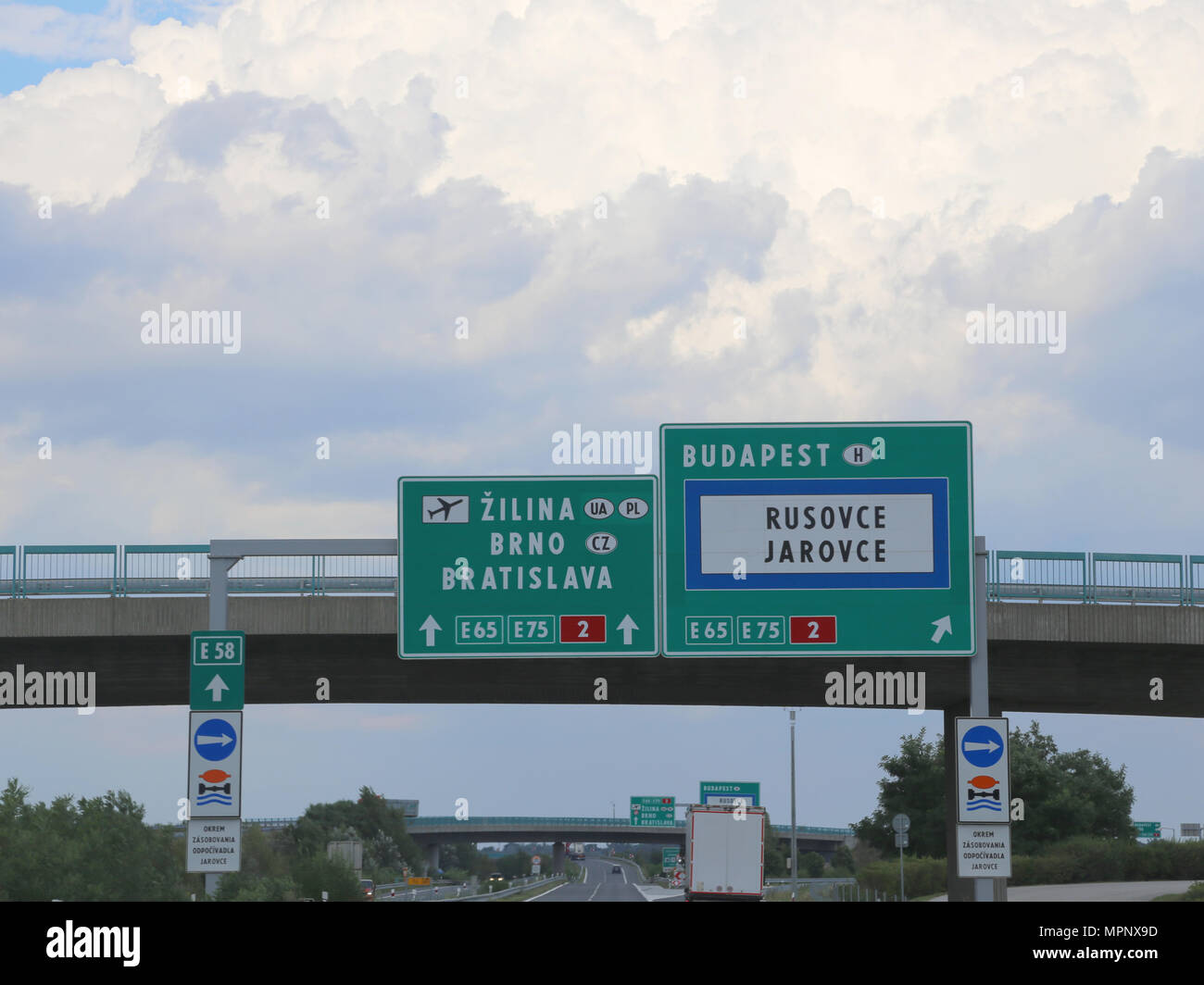 Signpost with motorway signs to reach Budapest or Bratislava Stock ...