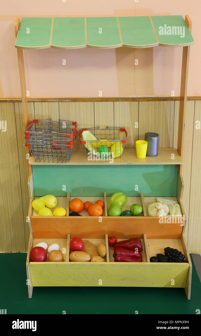 Small fruit stand with lots of plastic fruit to play the children who ...