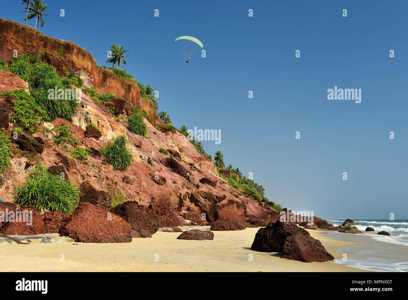 Exotic orange cliff beach in Varkala. Kerala. India Stock Photo - Alamy