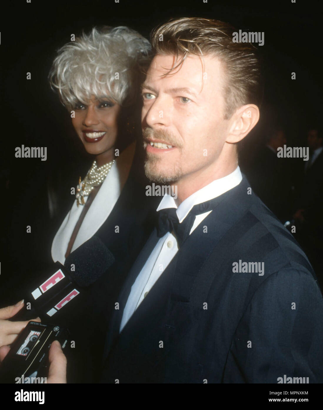 WEST HOLLYWOOD, CA - MARCH 4: (L-R) Model Iman and singer David Bowie ...