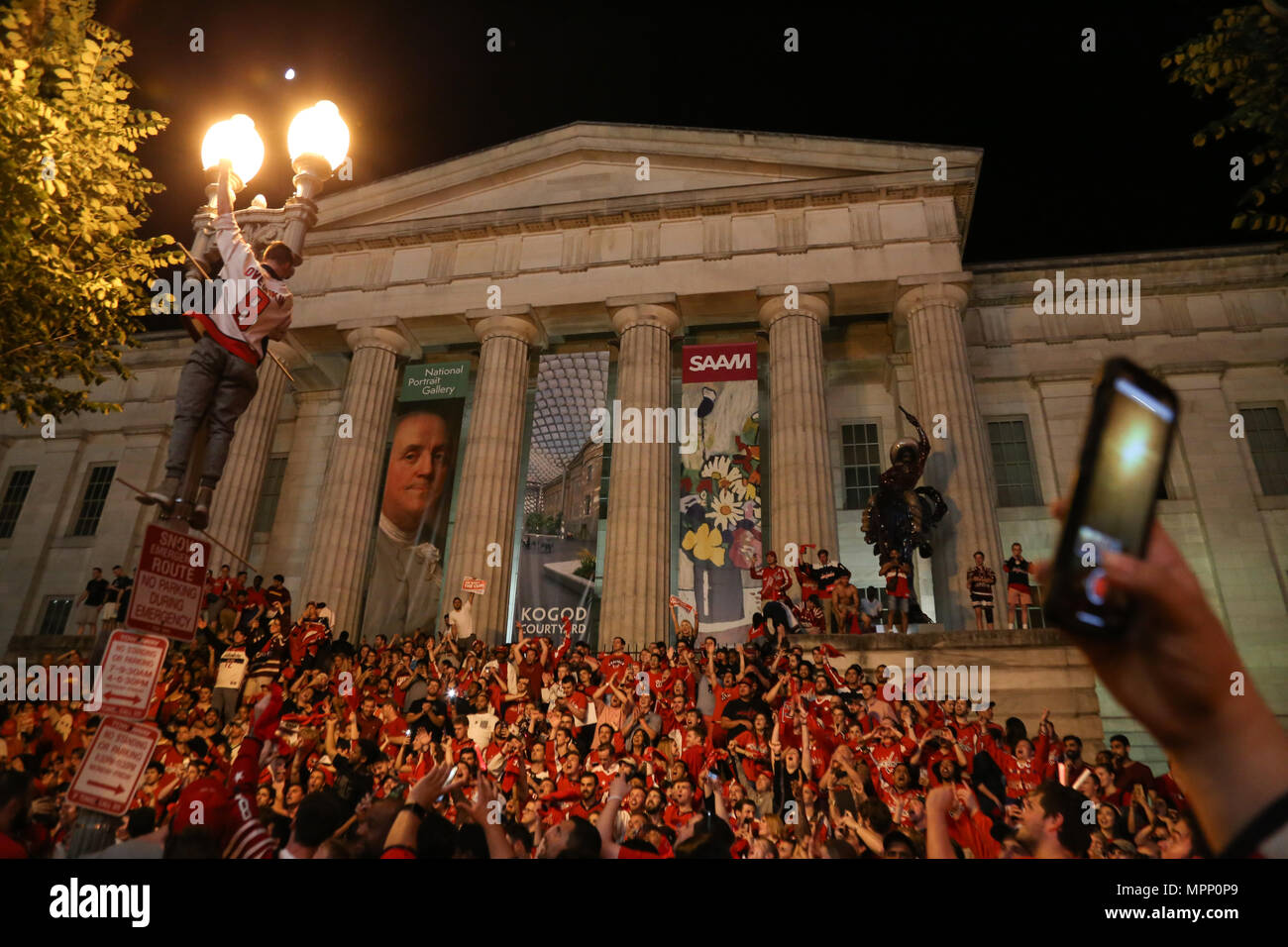 Washington, USA. 23rd May, 2018. Capitals fans celebrate on the steps ...