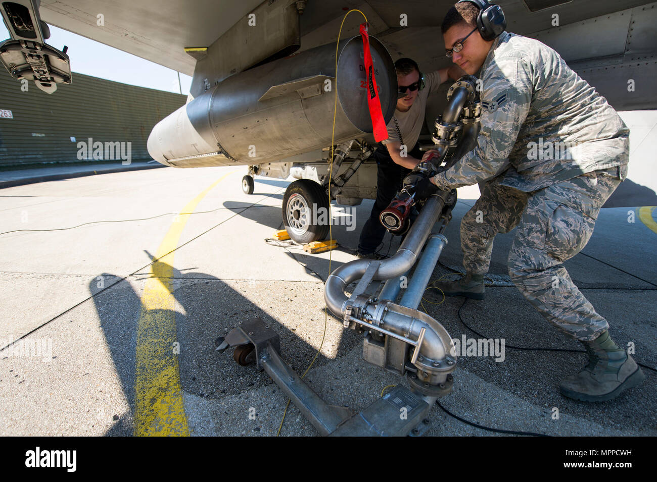 U.S. Air Force Airman 1st Class Matt Mac Rae, left, 52nd Aircraft ...