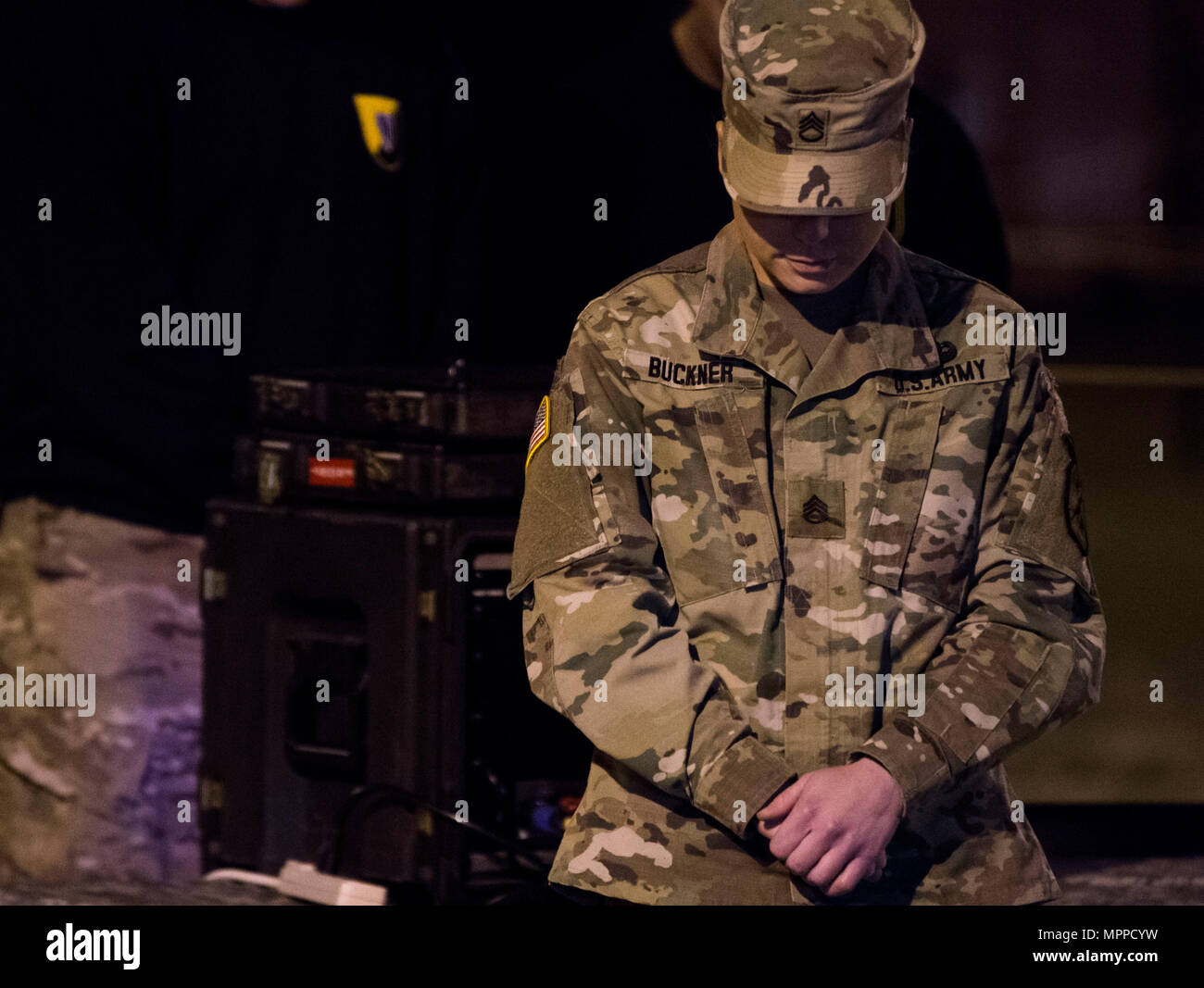 U.S. Army Staff Sergeant Kara Buckner bows her head during the ...