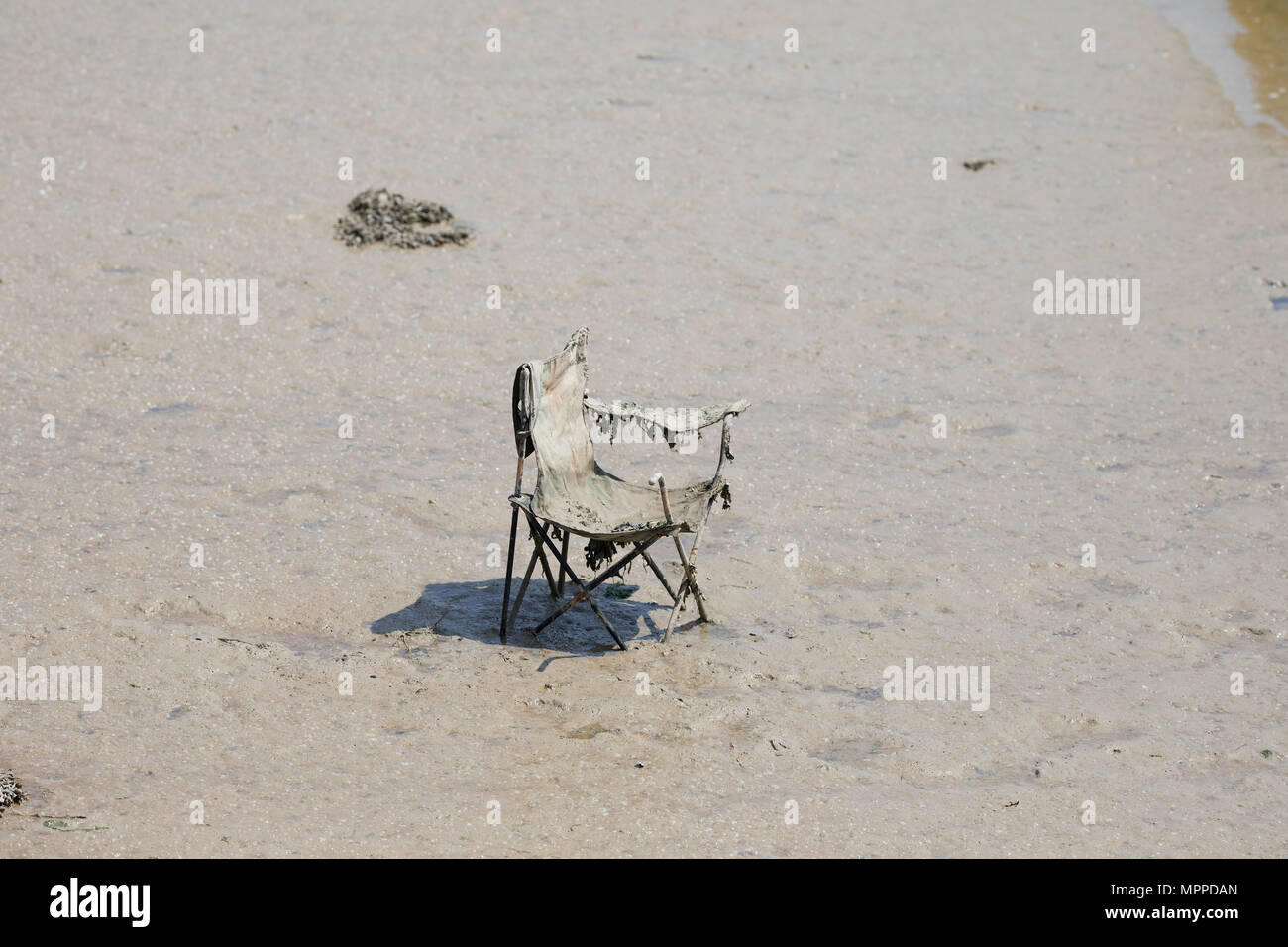 Disused chair on a beach hi-res stock photography and images - Alamy