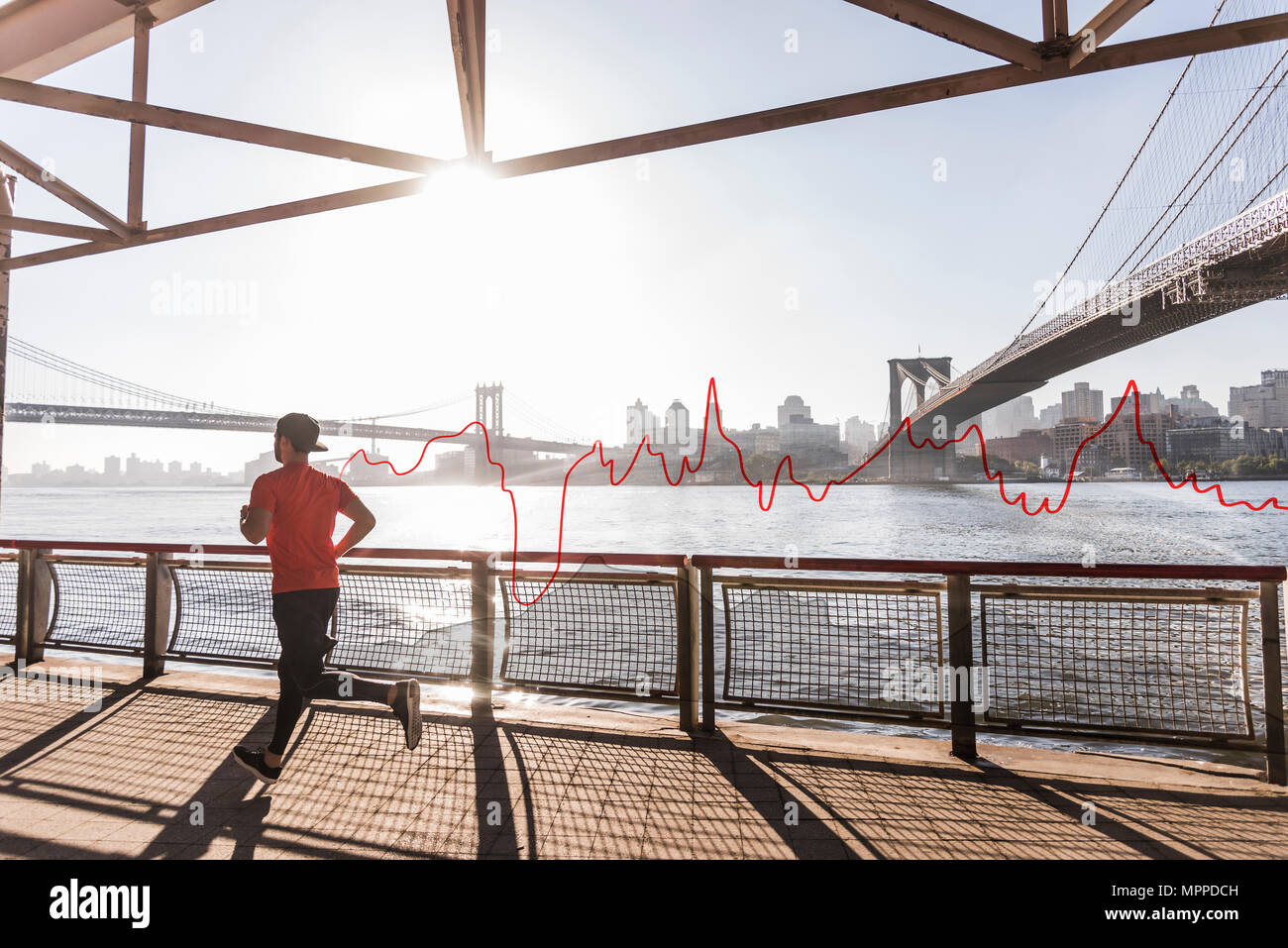 USA, New York City, man running at East River with line graph behind ...