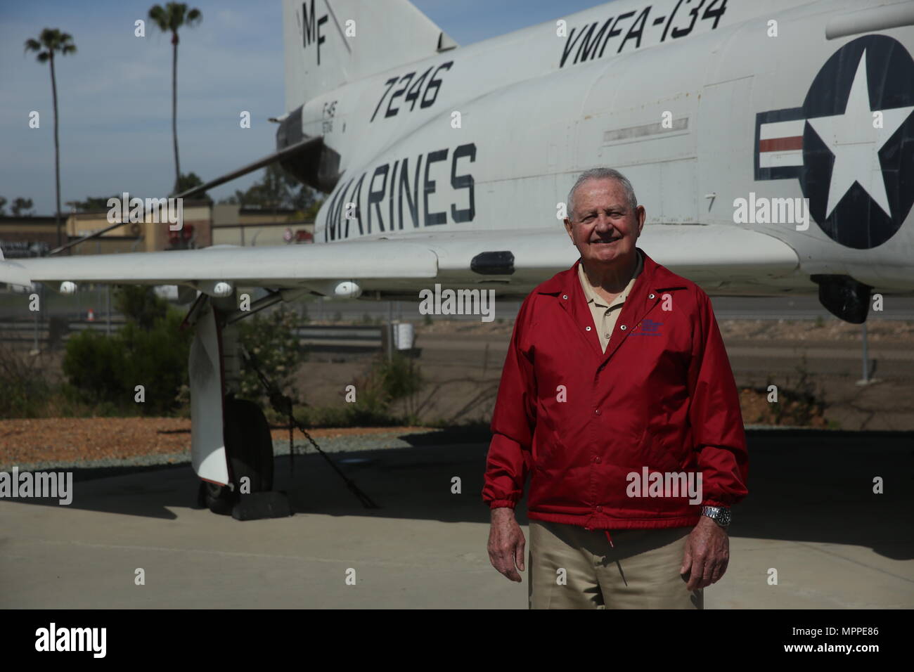 Retired Lt. Col. Jay Bibbler stands in front of a McDonald Douglas F-4S ...