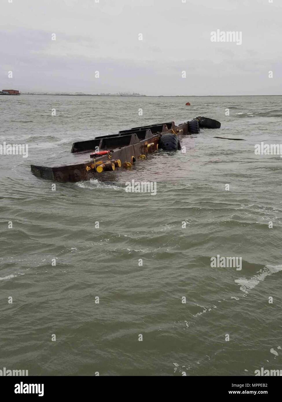 The 112-foot freight barge Vengeance is pictured after capsizing near ...