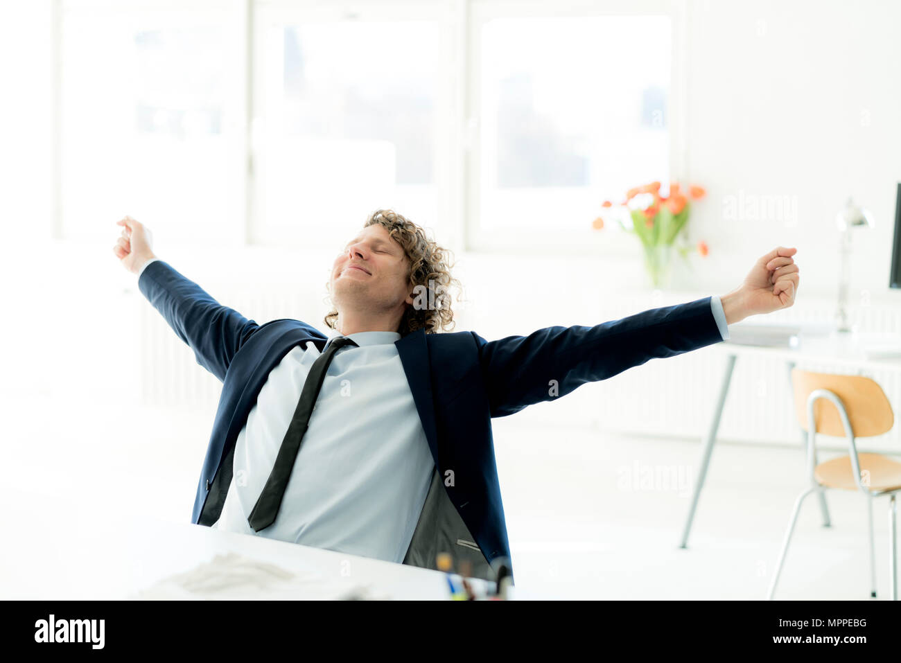 Relaxed businessman taking a break in his office Stock Photo - Alamy