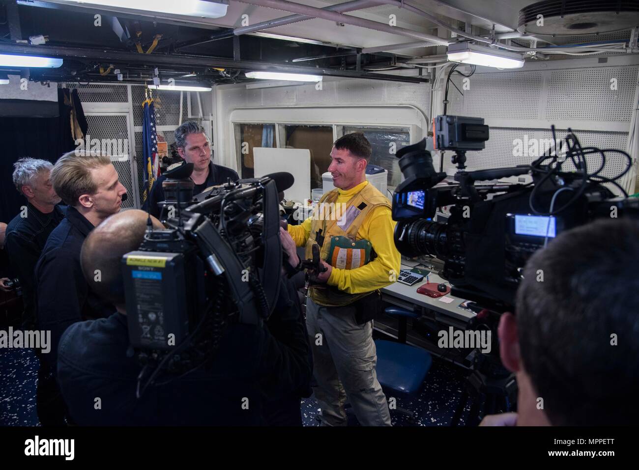 170404-N-QI061-446 ATLANTIC OCEAN (April 4, 2017) Lt. Robert Castor, from Philadelphia, speaks ...