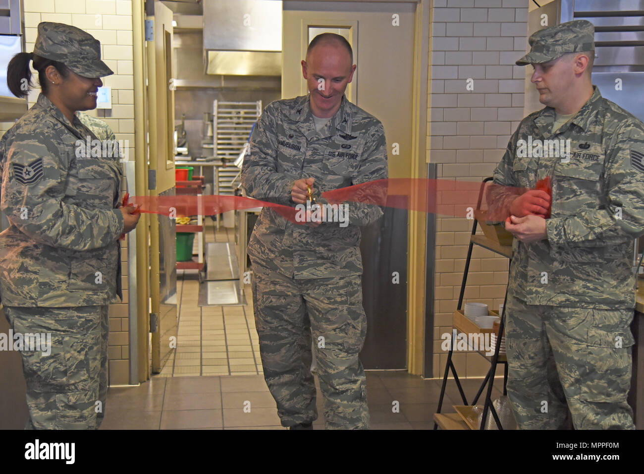 Col. Ryan Samuelson, 92nd Air Refueling Wing commander, cuts the ribbon ...