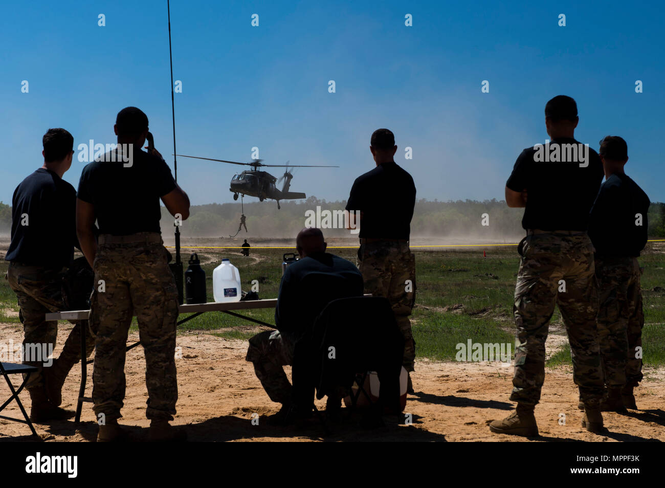 U.S. Army Ranger instructors watch competitors of the Best Ranger ...