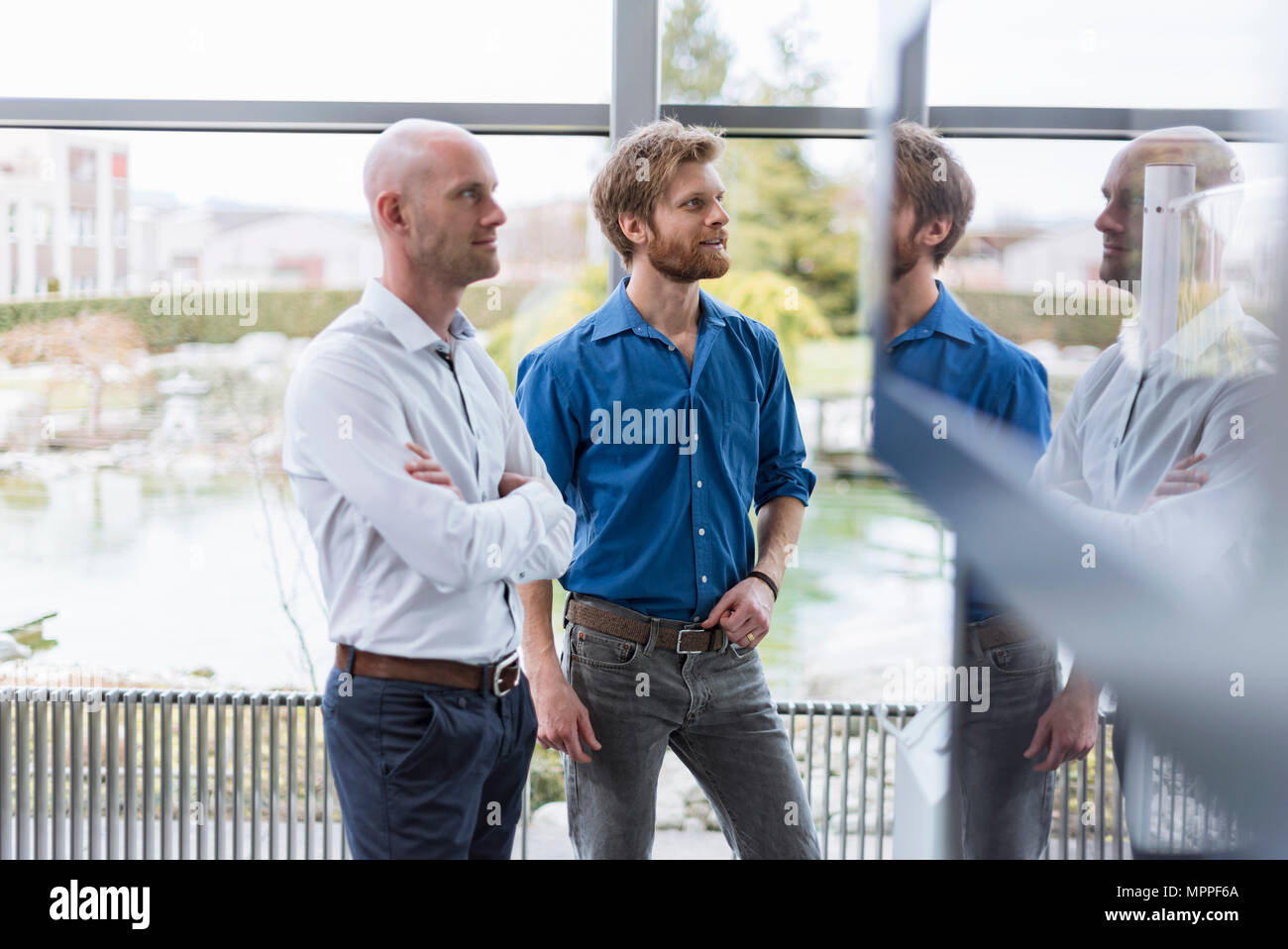 Two standing men hi-res stock photography and images - Alamy