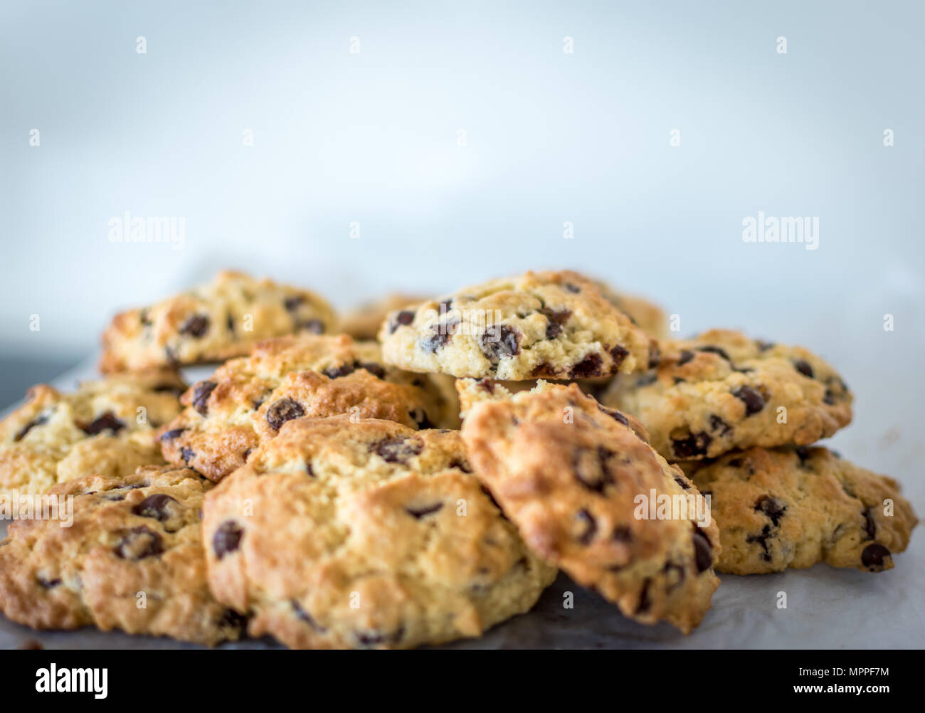 Pile of choc chip cookies hi-res stock photography and images - Alamy