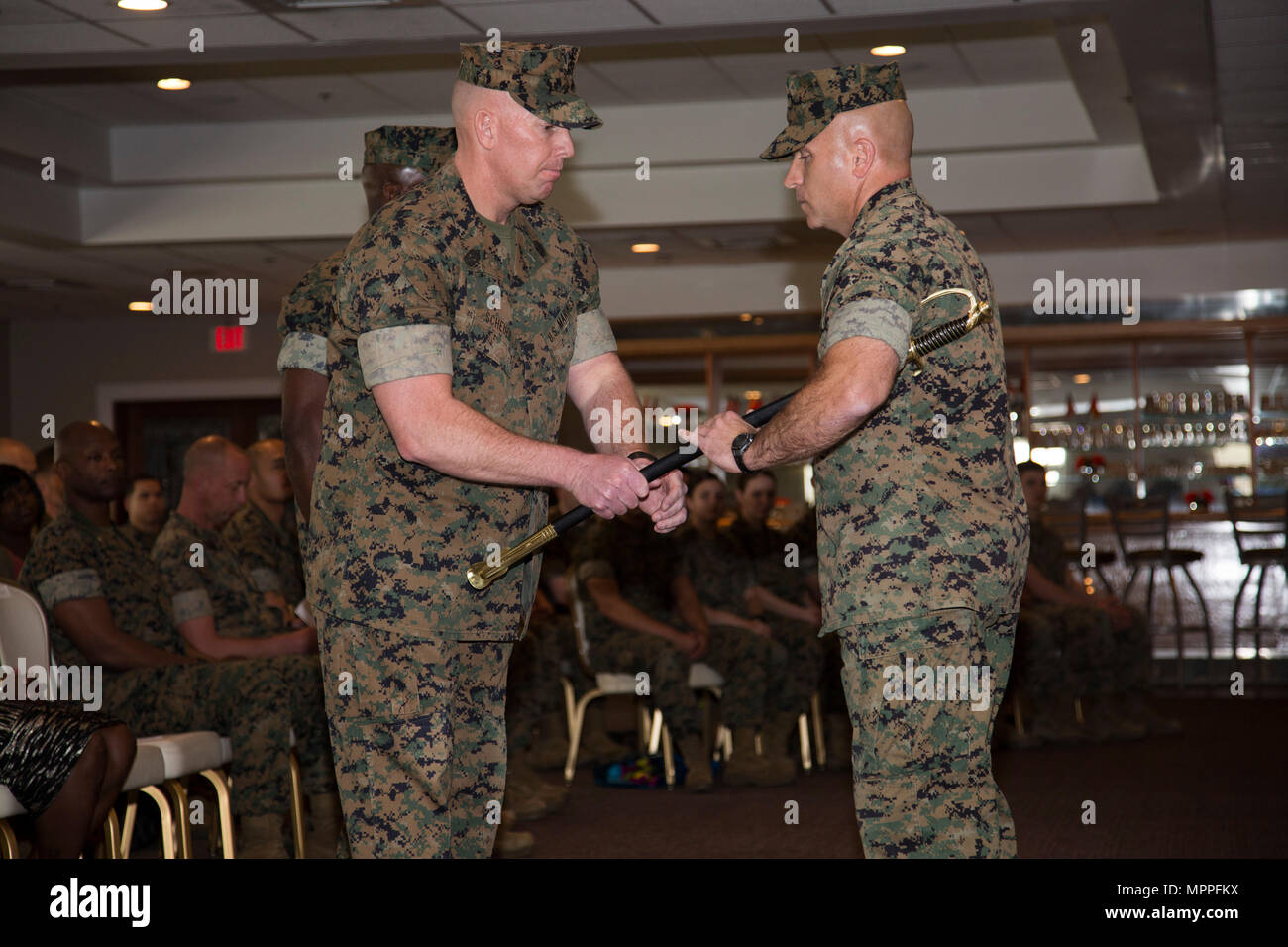 U.S. Marine Corps Sgt. Maj. Brett C. Scheuer, left, sergeant major ...