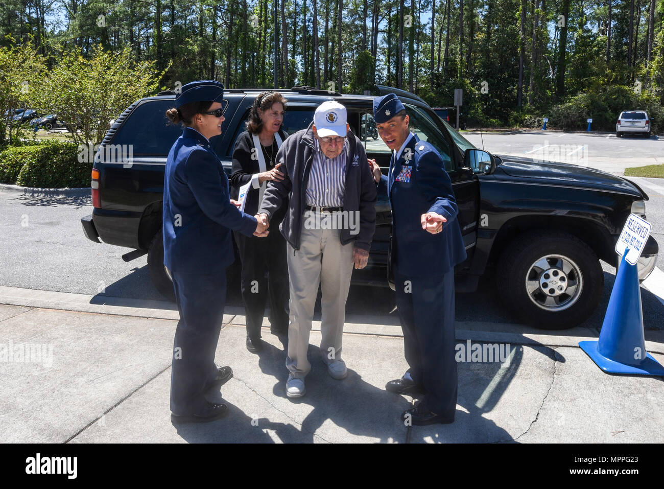 Retired Lt. Col. Richard E. Cole is greeted by Lt. Col. Allison Black ...