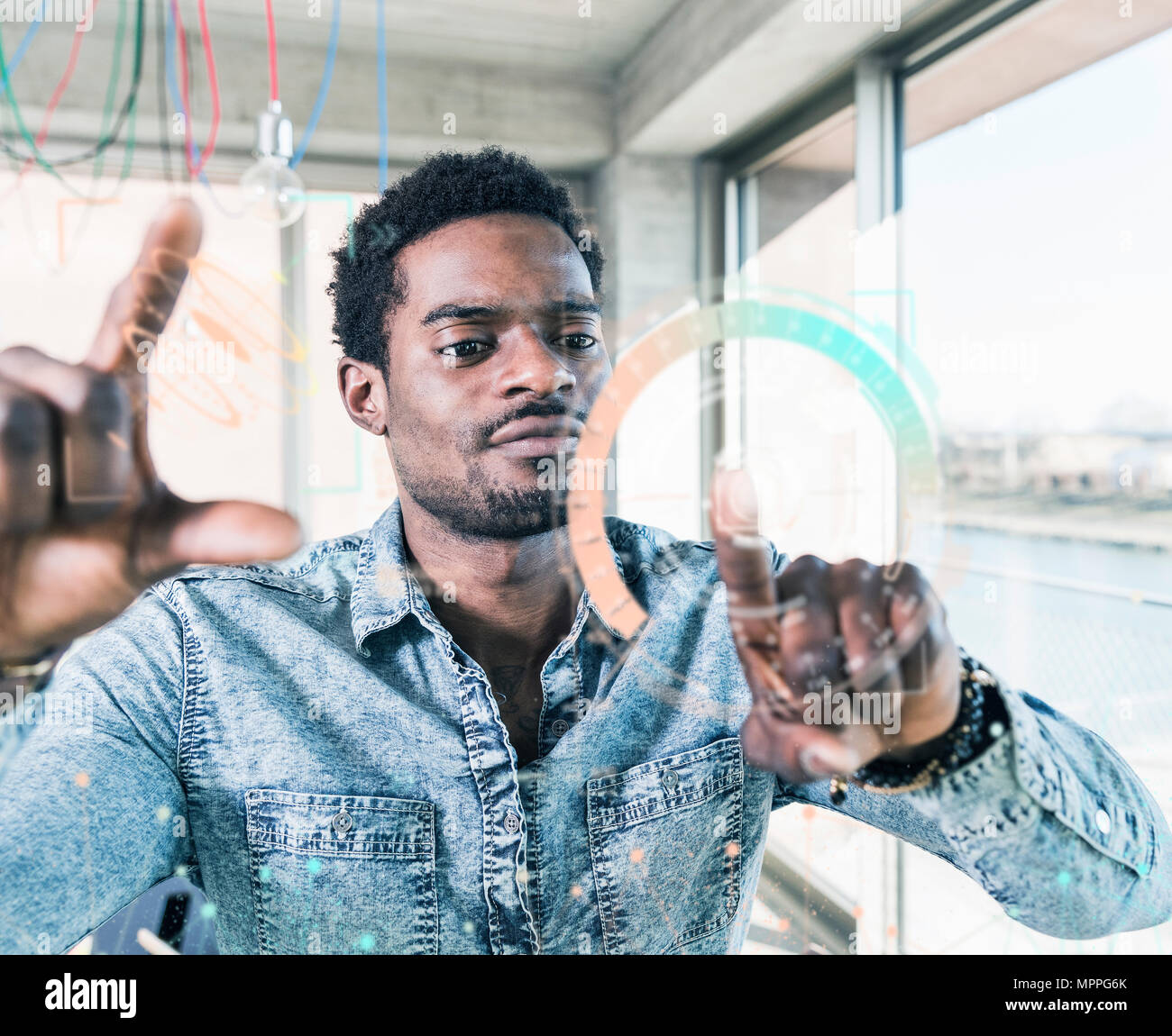 Casual businessman touching glass pane with data in office Stock Photo ...