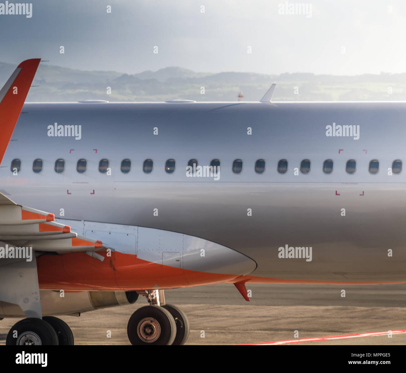 Side view of a parked airplane Stock Photo - Alamy