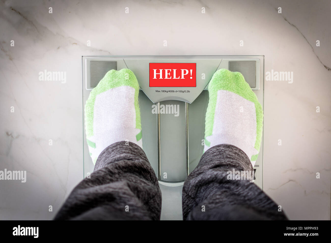 Overweight man and woman on scales hi-res stock photography and images ...