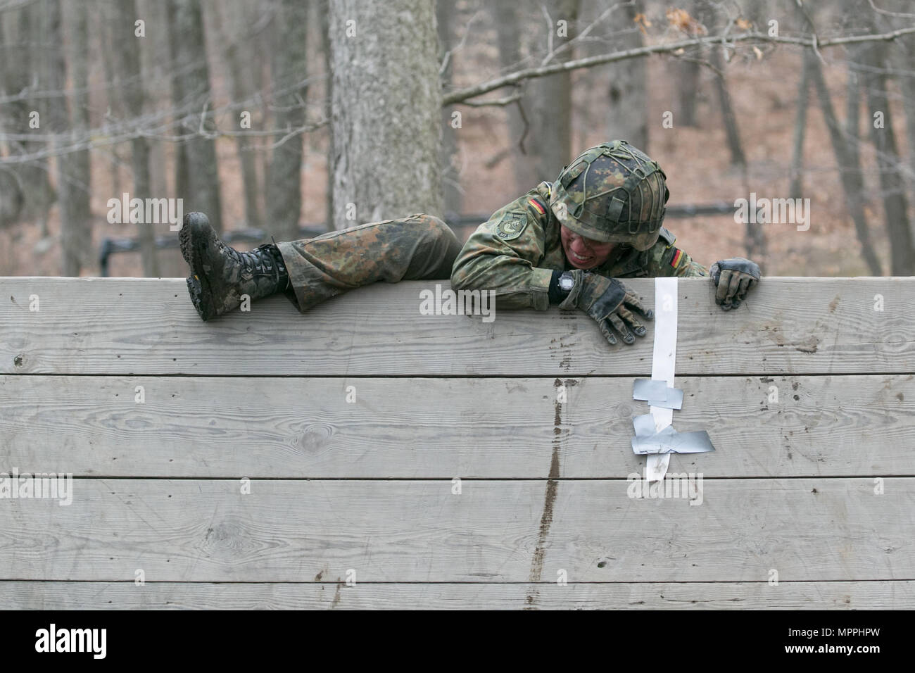 A German cadet negotiates an obstacle during the 2017 Sandhurst ...