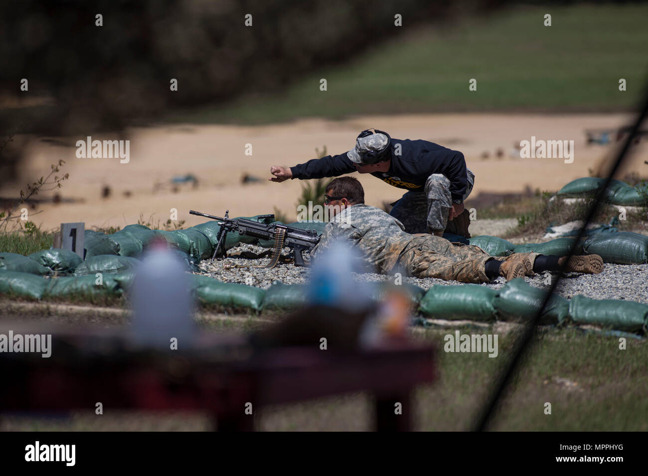 U.S. Army Ranger Instructor briefs a Ranger competitor on the event ...
