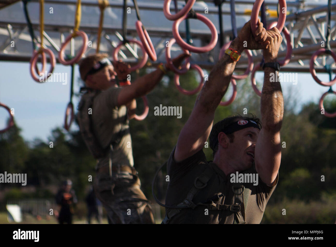 U.S. Army Rangers swing through an obstacle while competing in the ...