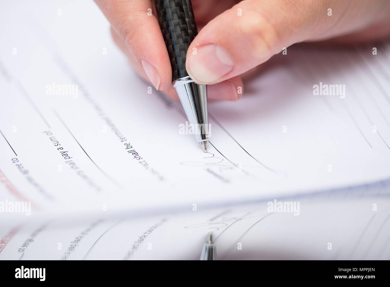 Woman hand signing documents hi-res stock photography and images - Alamy