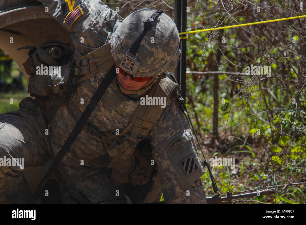 A U.S. Army Ranger assigned to the 3rd Infantry Divisions climbs from a ...