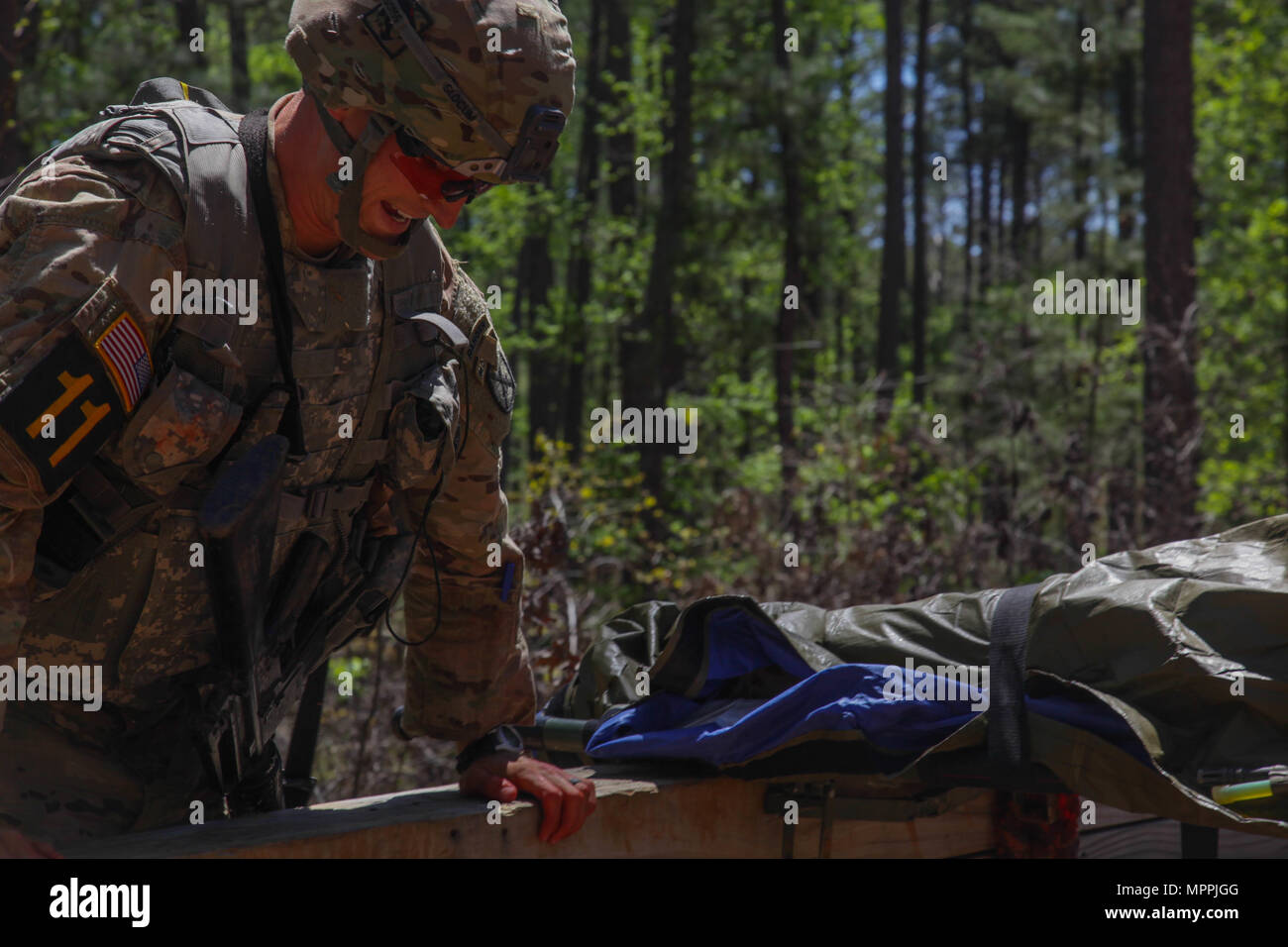 U.S. Army Ranger Matthew Slocum climbs over a wall on the Ranger First ...