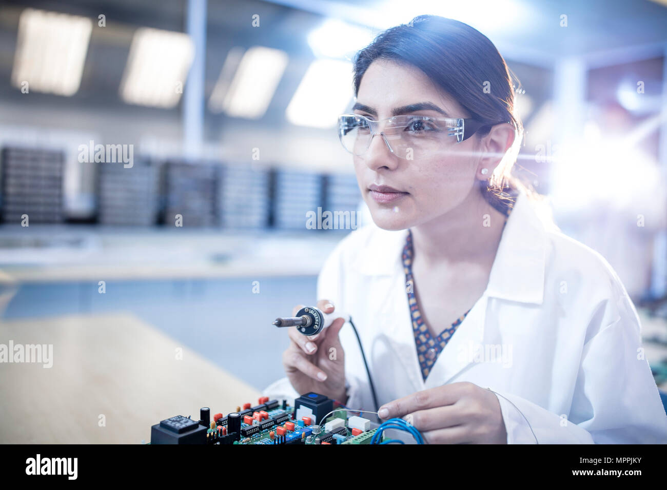 Female technician working on motherboard Stock Photo - Alamy