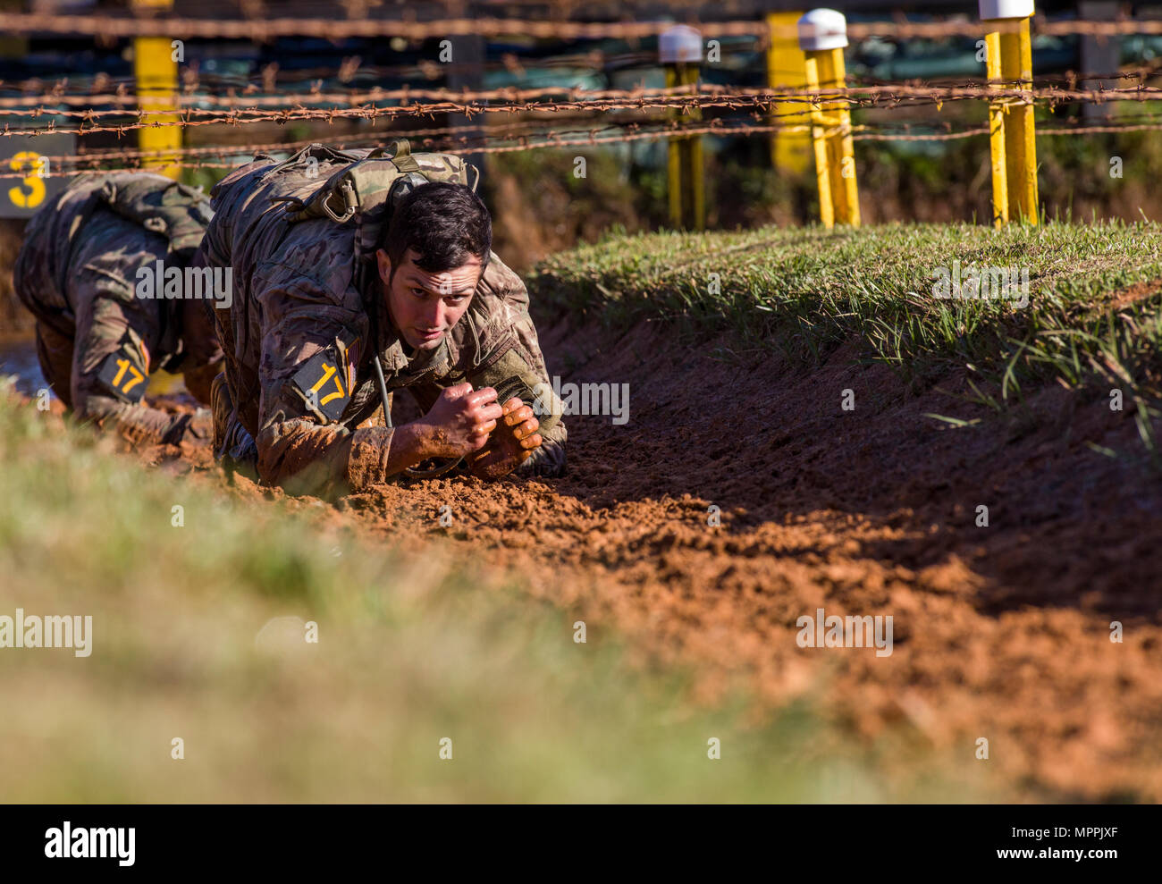 U.S. Army Rangers from the 82nd Airborne Division execute a low-crawl ...