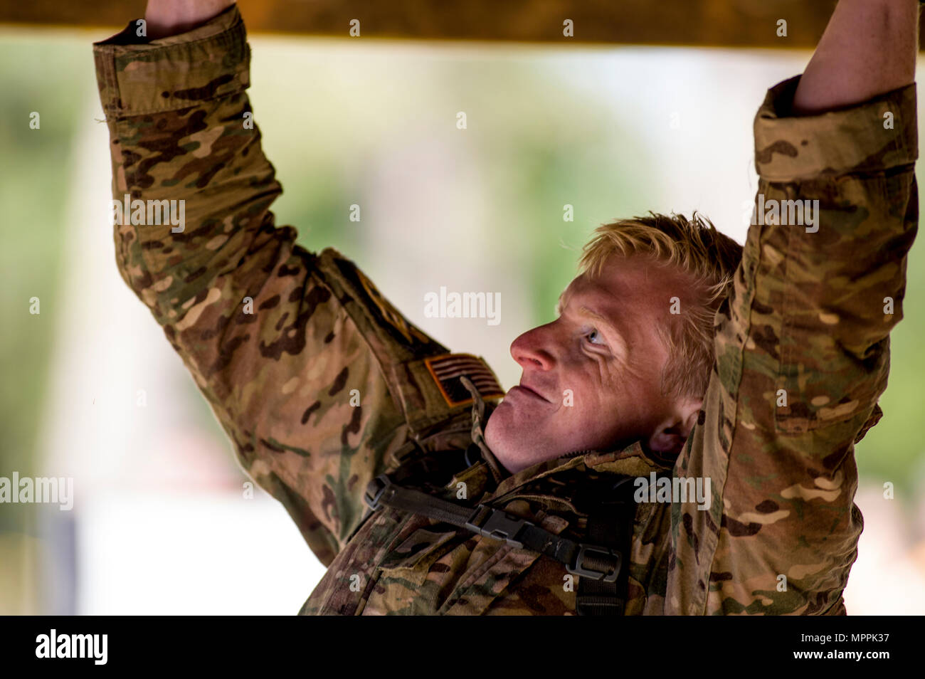 A U.S. Army Ranger crosses an obstacle at the Malvesti Obstacle Course ...