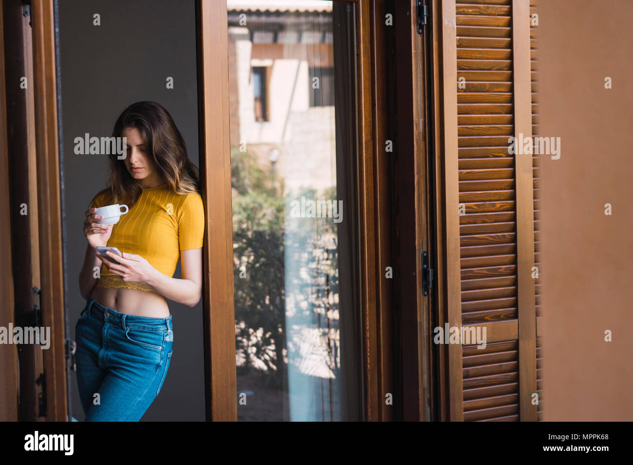 Leaning against window frame hi-res stock photography and images - Alamy