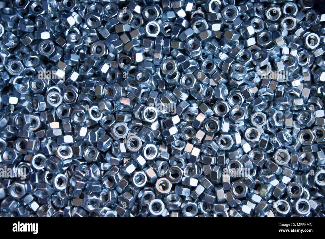 big pile of screw nuts as background Stock Photo - Alamy