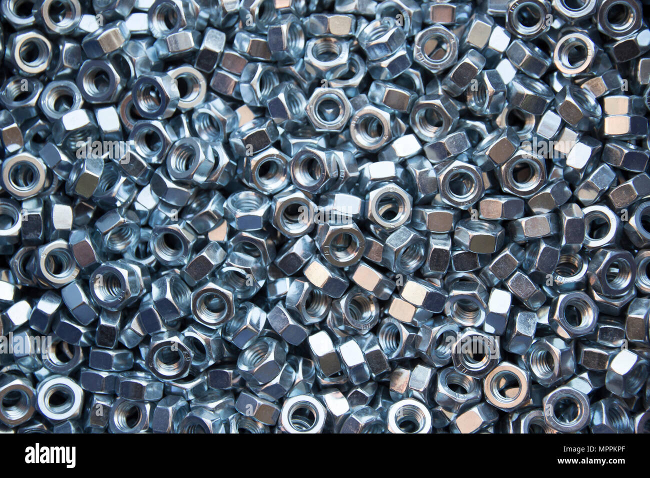 big pile of screw nuts as background Stock Photo - Alamy