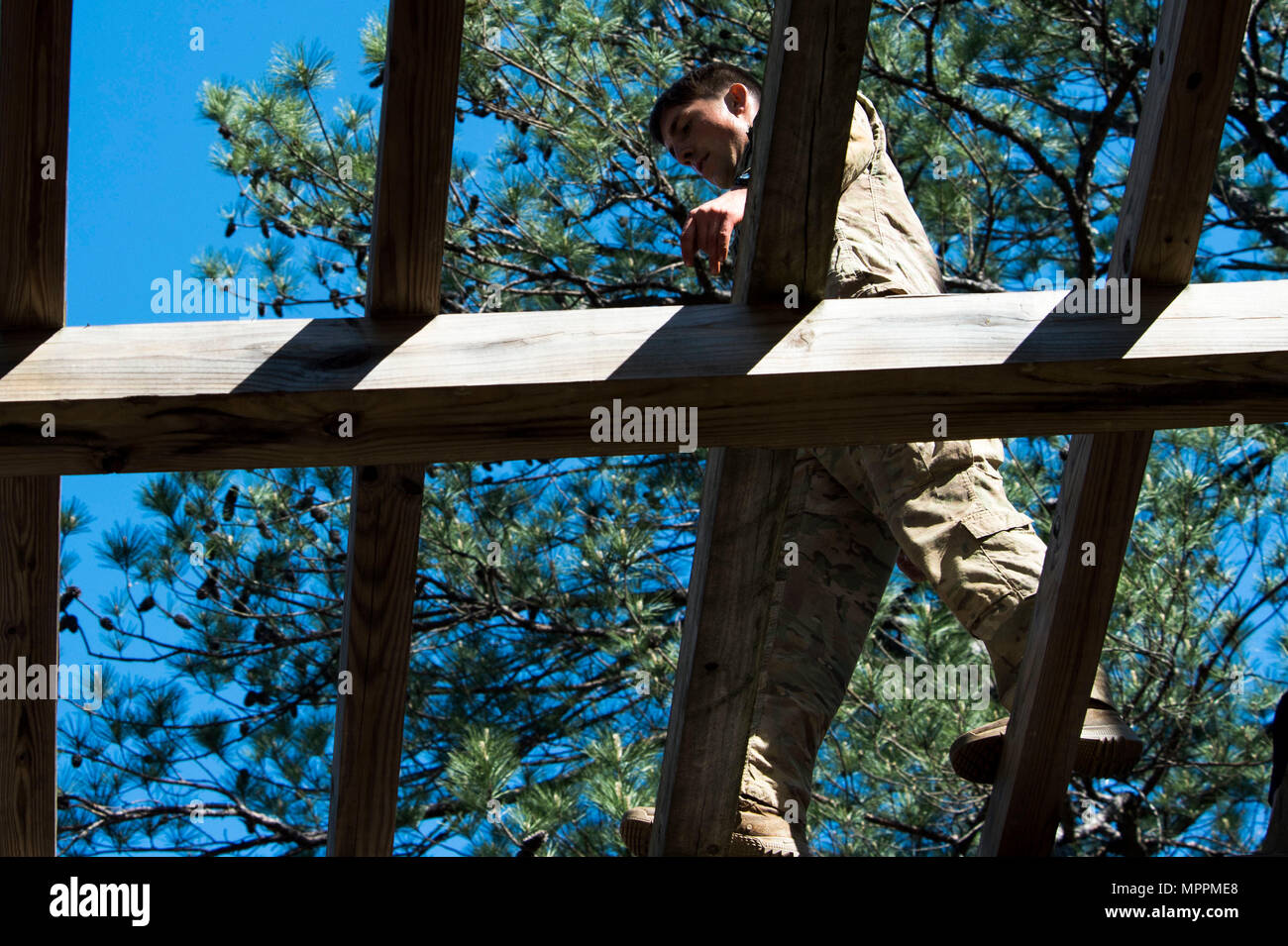 A U.S. Army Ranger traverses an obstacle at the Darby Queen obstacle ...