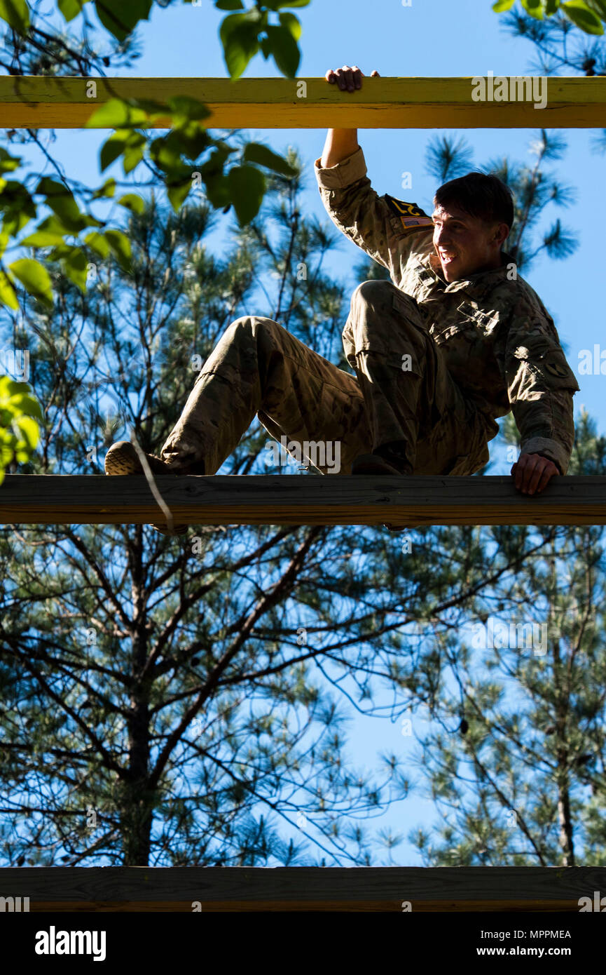 U.S. Army Capt. Michael Hauser, 7th Infantry Division, climbs an ...