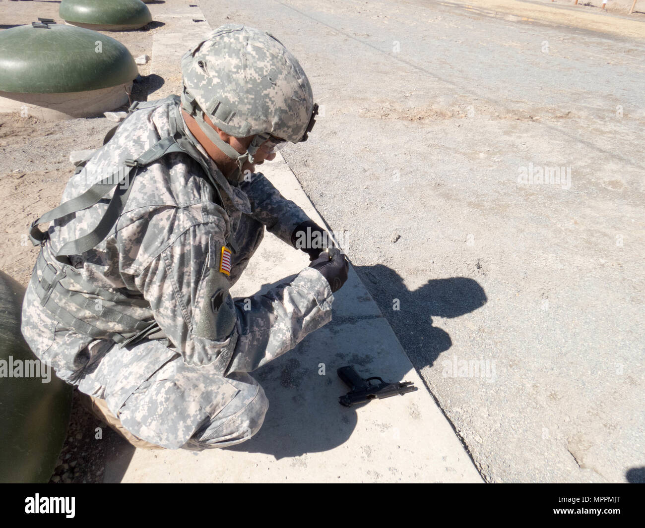 A U.S. Army Reserve Soldier with the 96th Sustainment Brigade loads ...