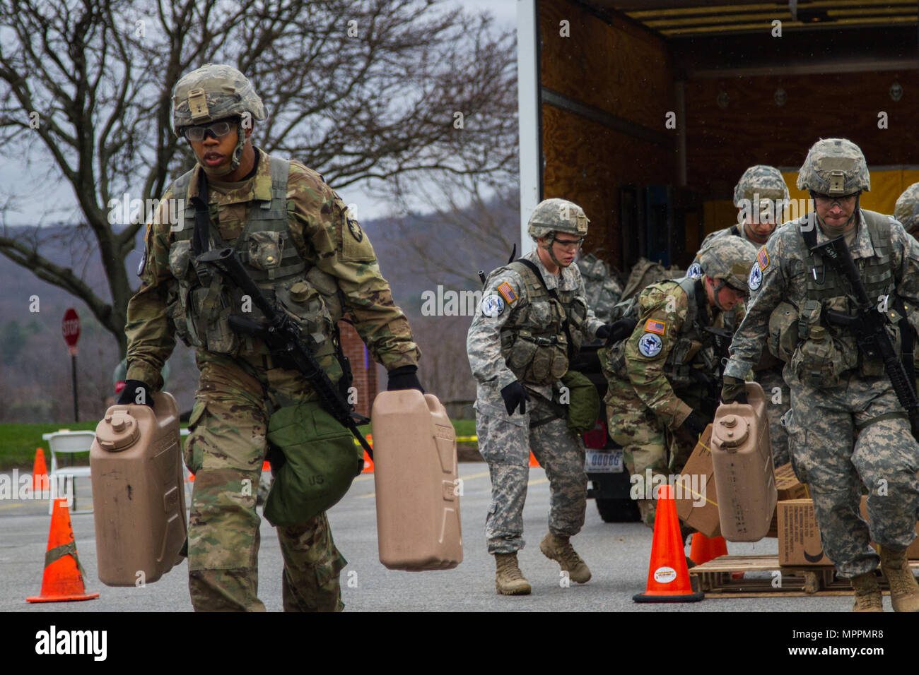 U.S. Army cadets carry water cans and other equipment during the 2017 ...