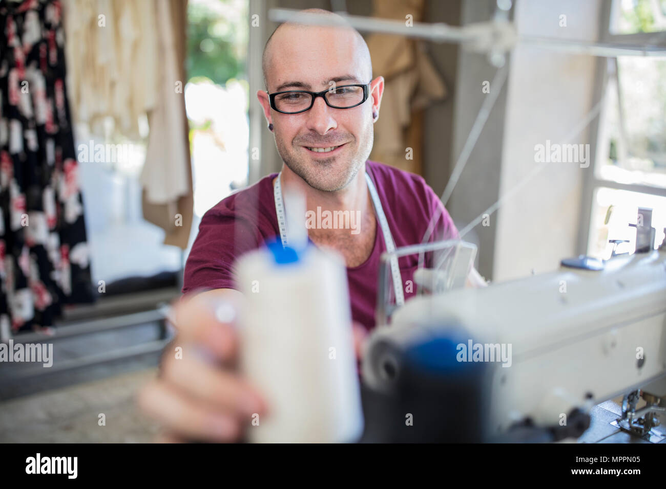 Competent tailor using sewing machine hi-res stock photography and ...