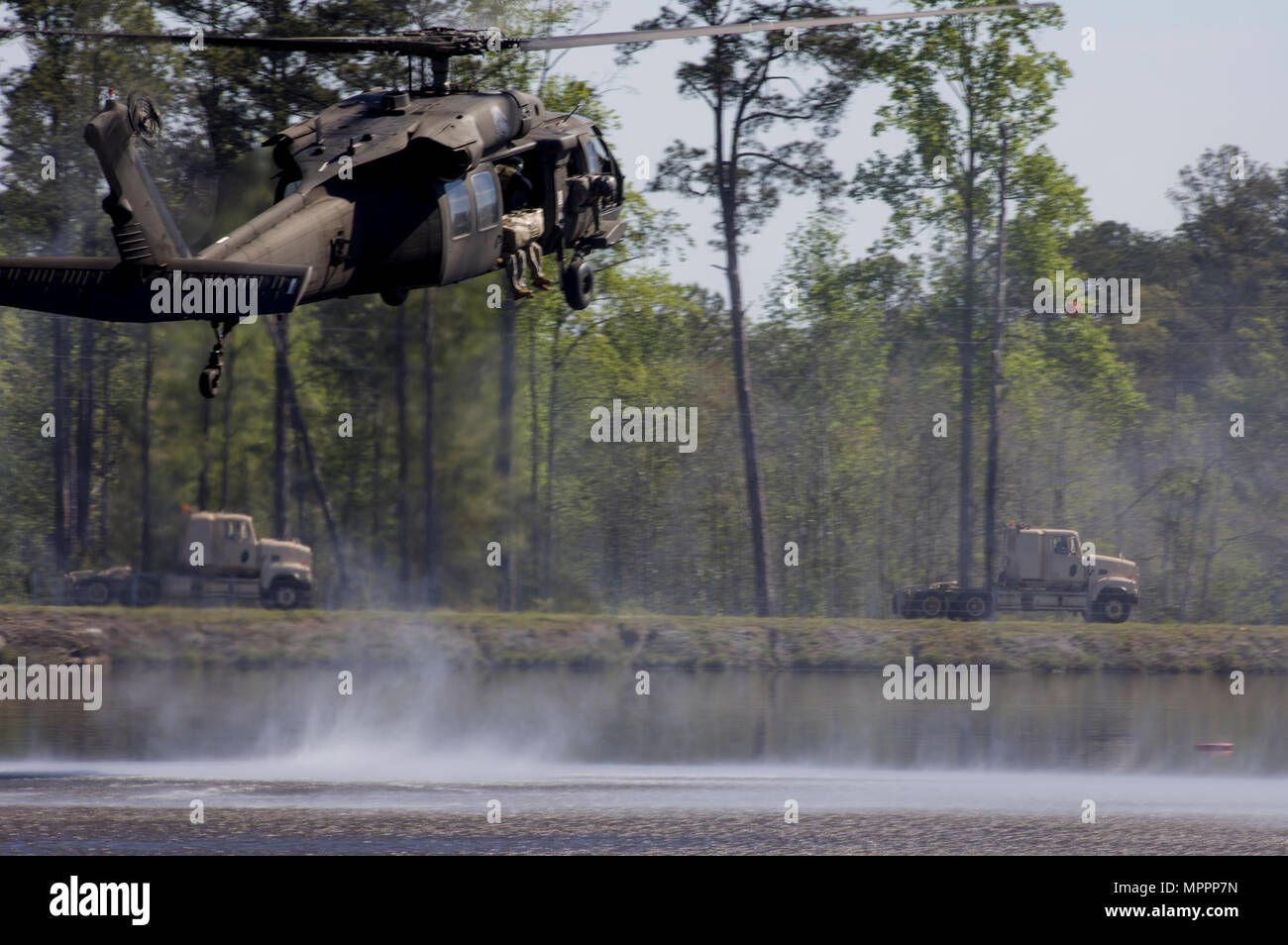 U.S. Army Rangers prepare to perform a helocast water insertion ...