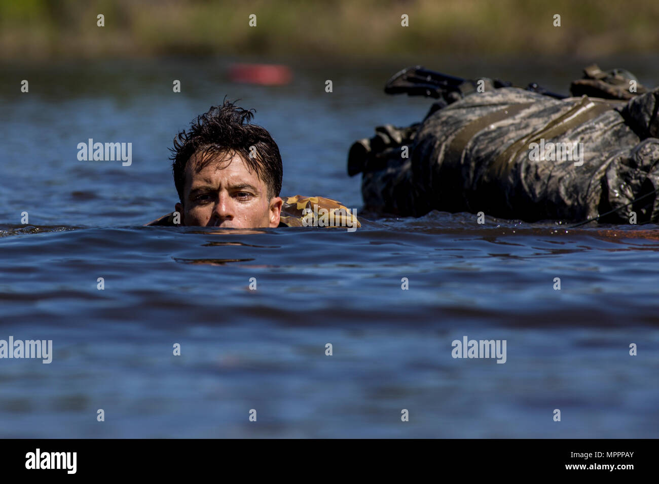 A U.S. Army Ranger swims ashore to perform the Combat Water Survival Assessment during the 34th ...