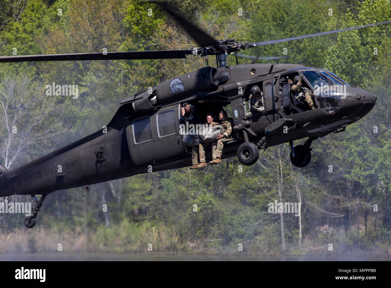U.S. Army Rangers prepare to perform a helocast water insertion ...