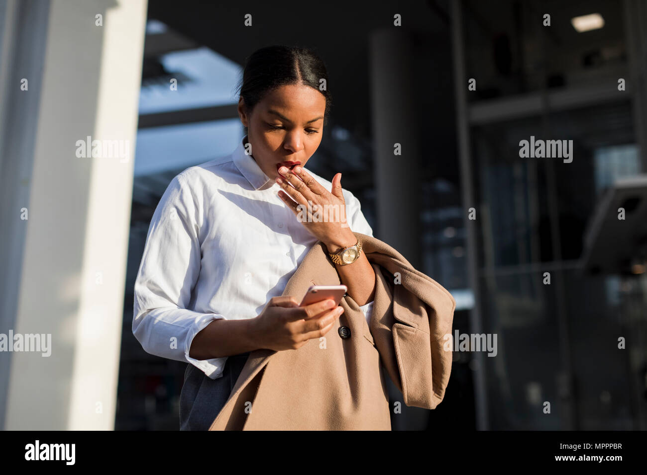 Portrait shocked businesswoman reading email mobile phone hi-res stock ...