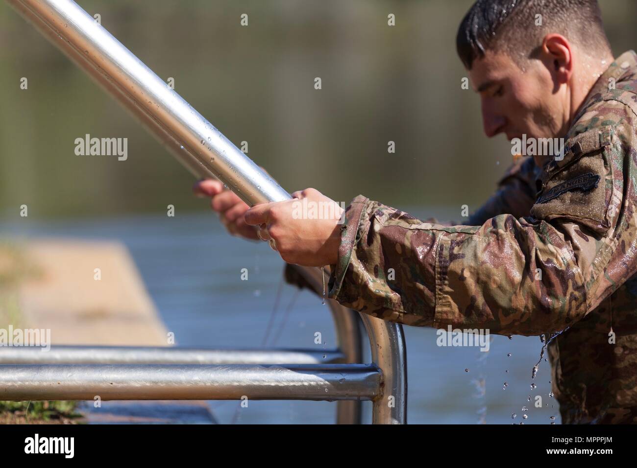 A U.S. Army Ranger ascends a ladder during the Best Ranger Competition ...