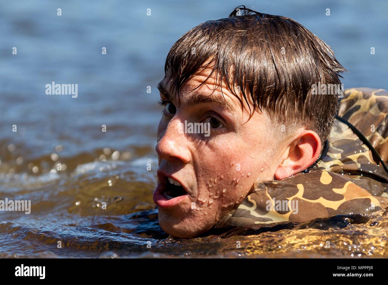 A U.S. Army Ranger swims to shore during the Best Ranger Competition ...