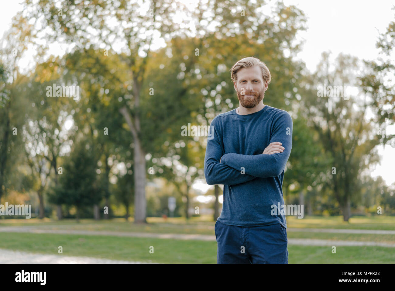 Portrait of man in a park Stock Photo - Alamy